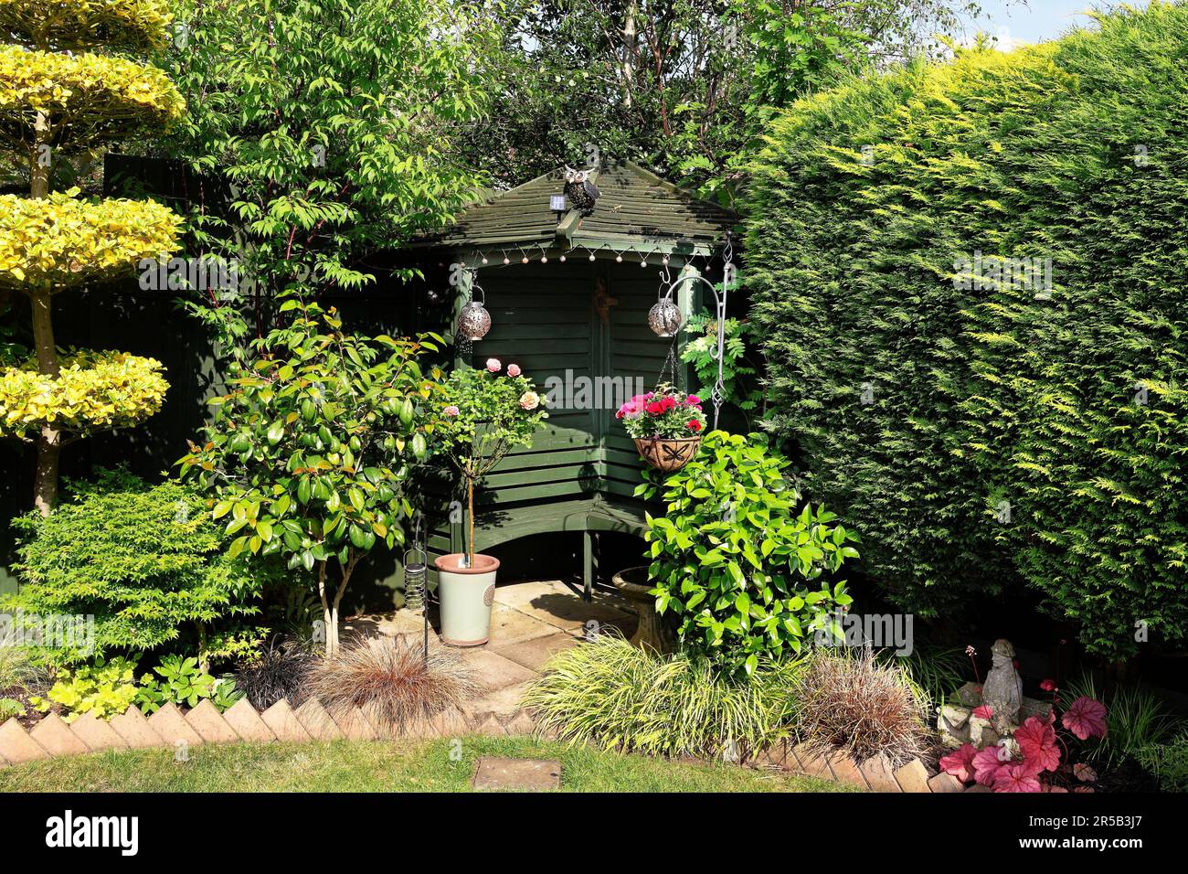English back Garden with Gazebo, hanging basket, planter and foliage ...