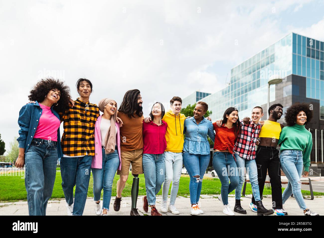 Happy multiracial friends having fun in the city - Friendship and ...