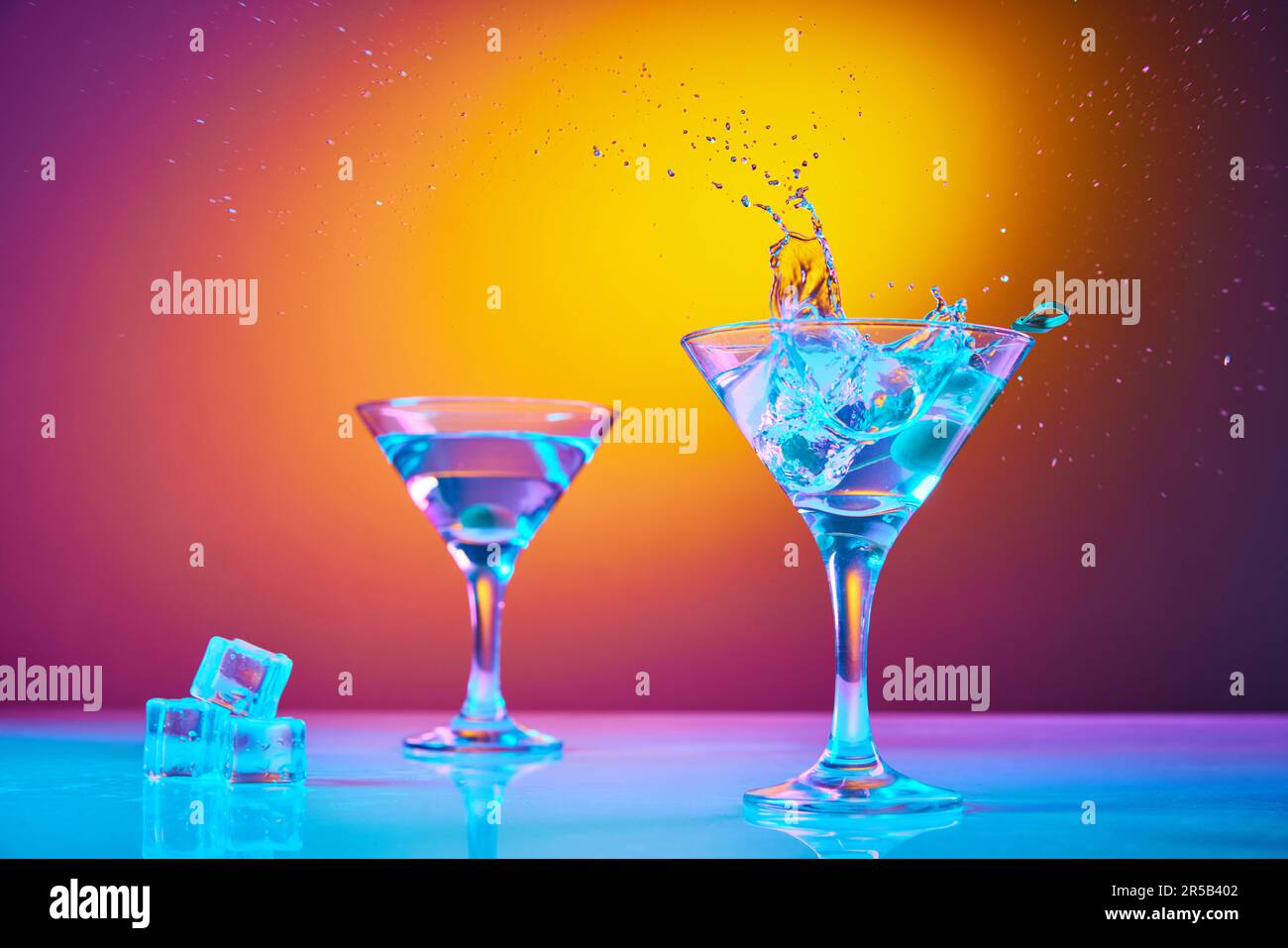 Portrait with glasses of classic dry martini cocktail with olives over ...