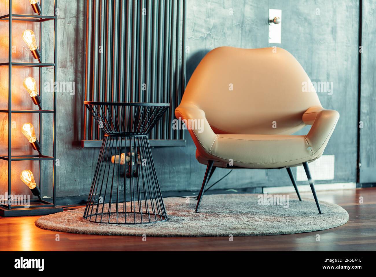 A contemporary interior of a room featuring a table and chair ...