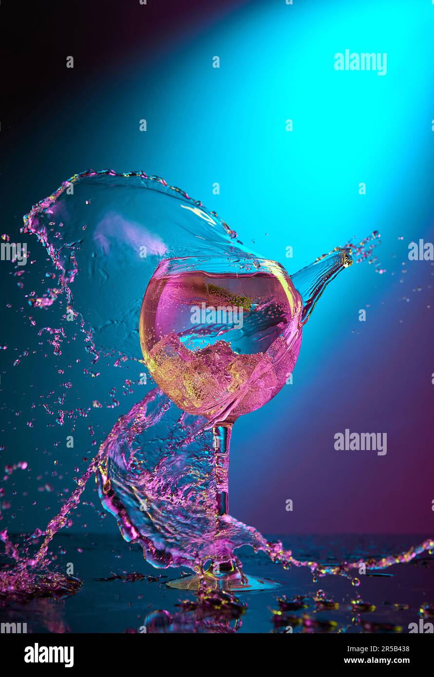 Colorful cocktail in glass, alcohol Mojito with splashes and lime slice ...