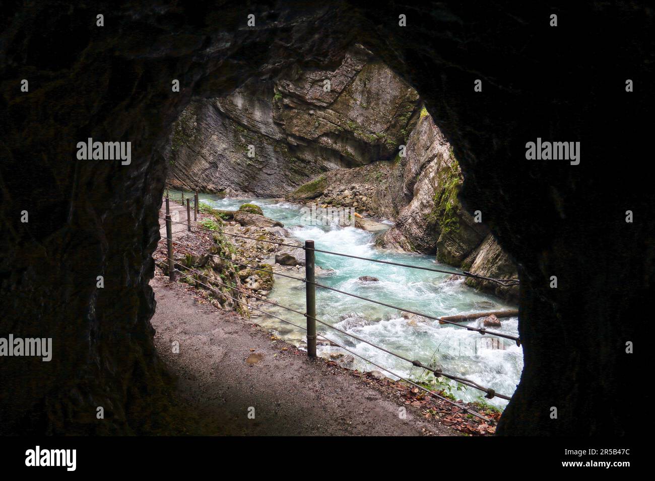 The view of a river in the Partnach Gorge, seen from a cave. Germany ...