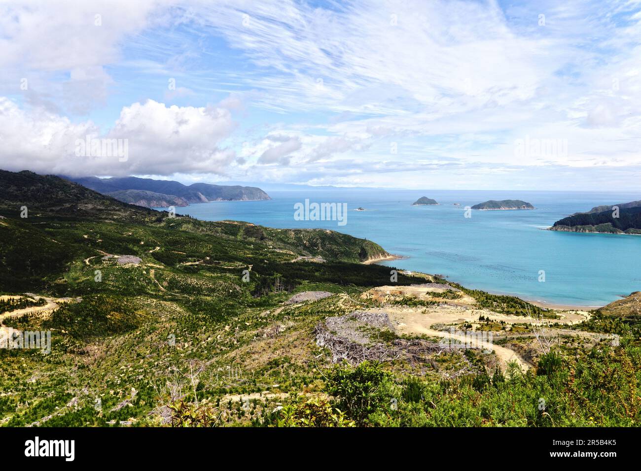 A breathtaking view of the green shoreline and blue sea. Marlborough ...