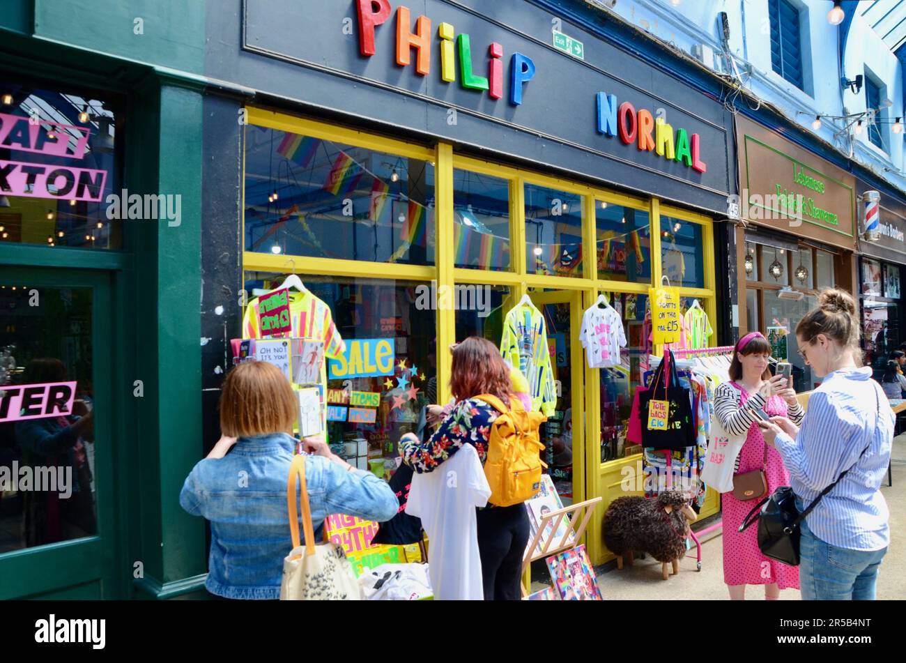 philip normal boutique; brixton SW9 market with stalls shops restaurants bars etc in arcade and ...