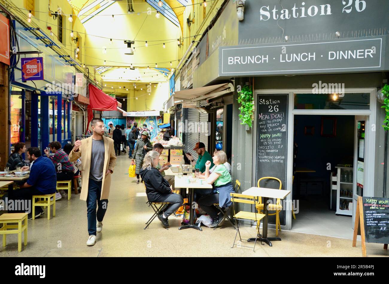 brixton SW9 market with stalls shops restaurants bars etc in arcade and ...