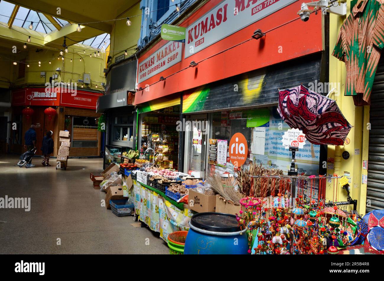 brixton SW9 market with stalls shops restaurants bars etc in arcade and ...