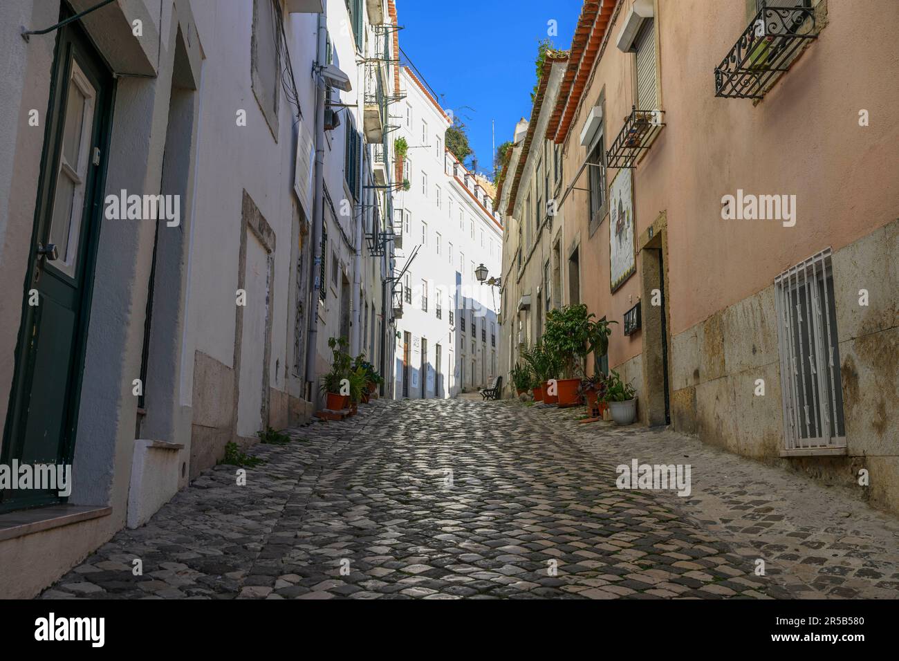 A scenic view of a traditional cobblestone street in a quaint town ...