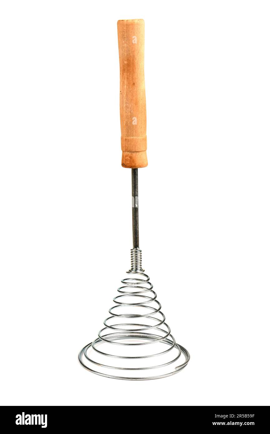 Close-up of old retro whisk kitchen tool on white background. Side view ...