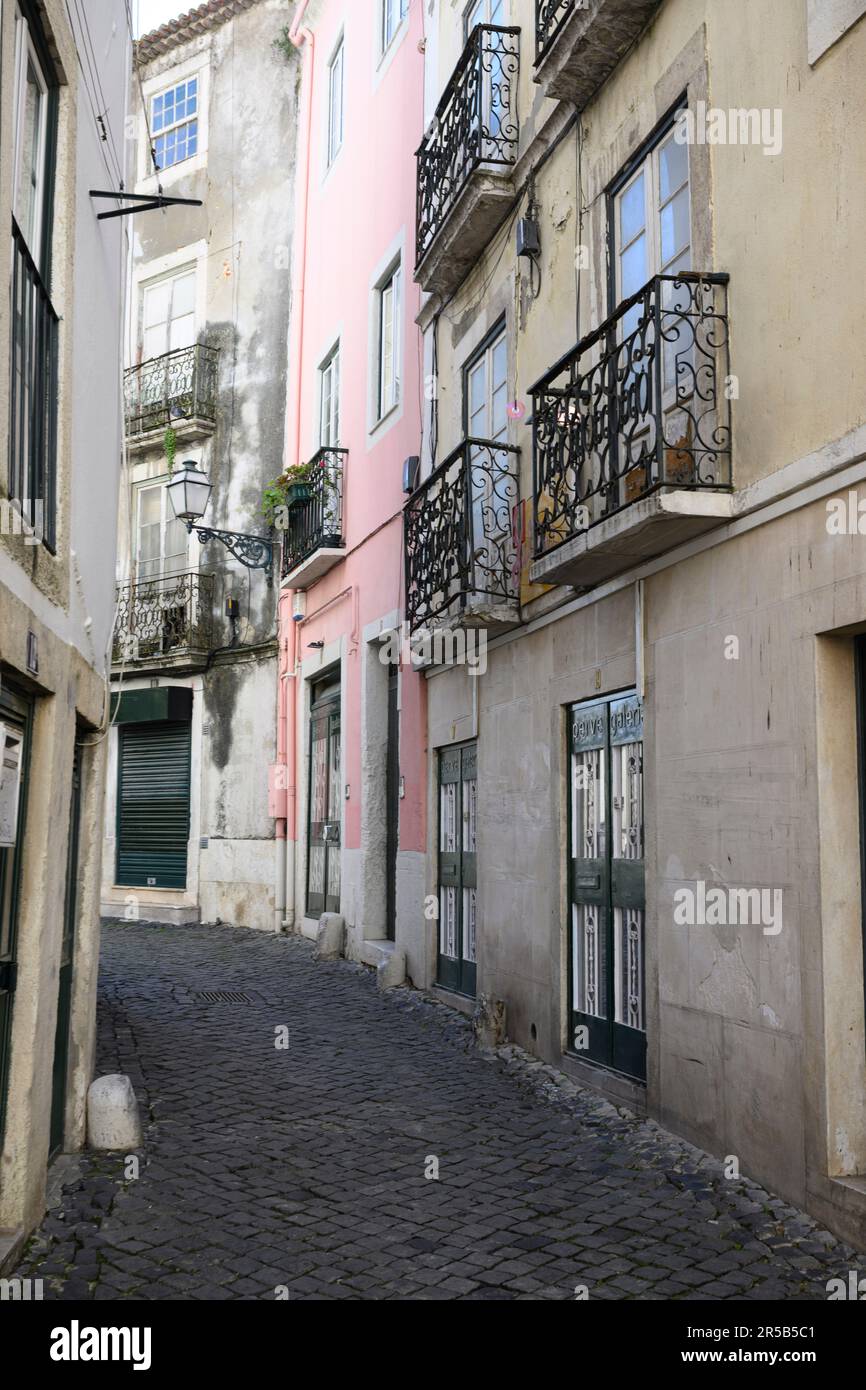An idyllic cobblestone street lined with quaint balconies and ...