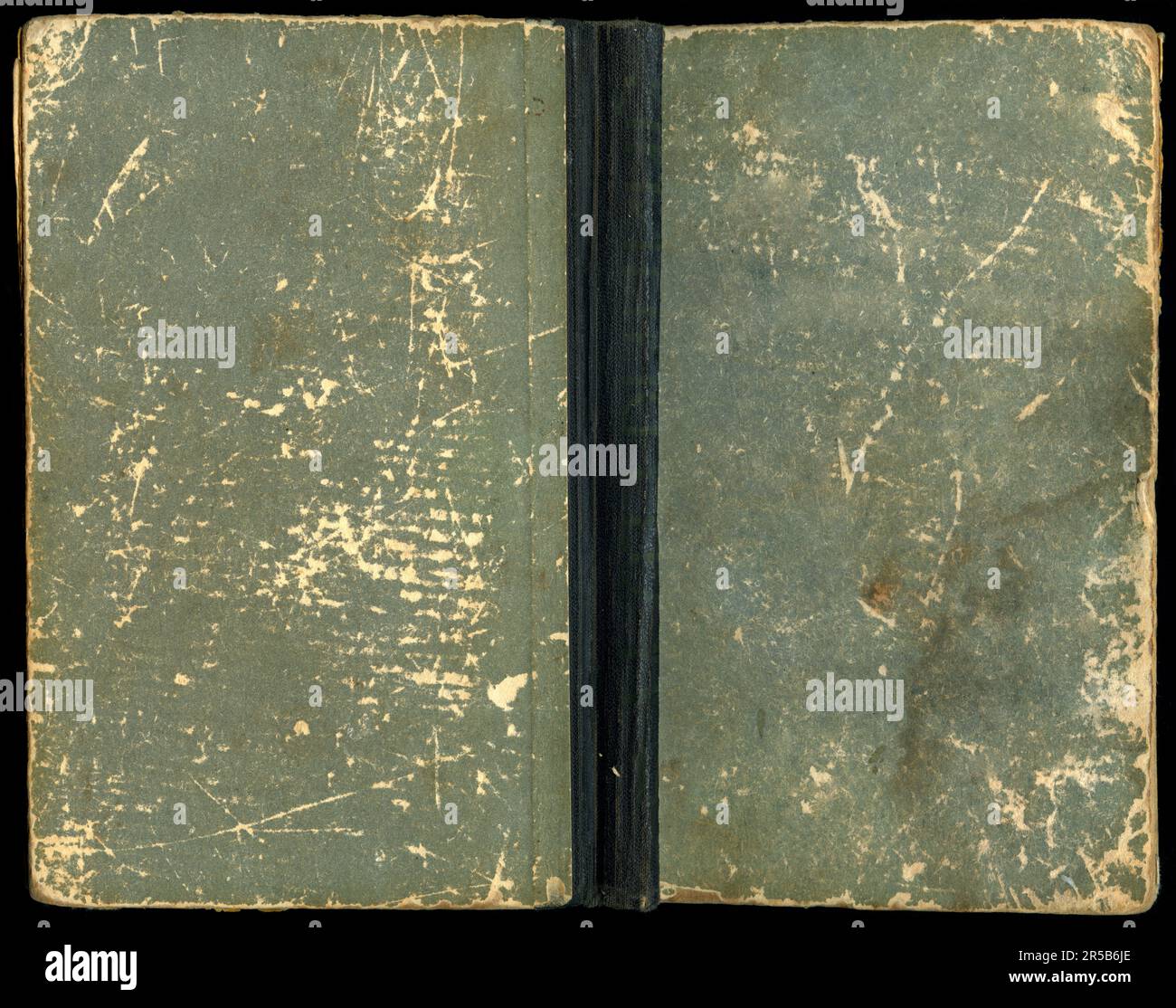 Cover of an old blue book on a black background. The book is unfolded ...