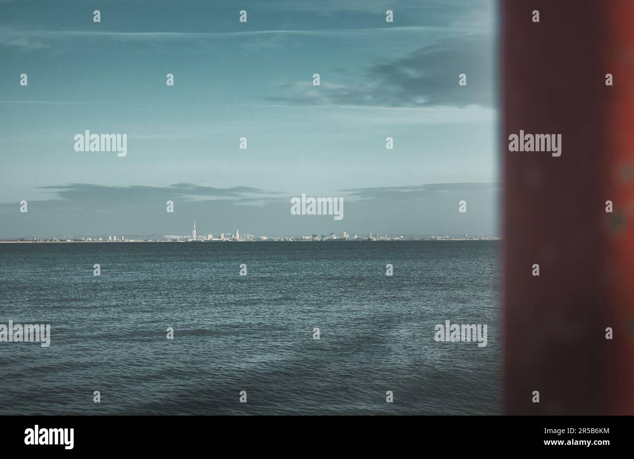 A scenic view of a pier and buildings from an exterior window, boasting ...