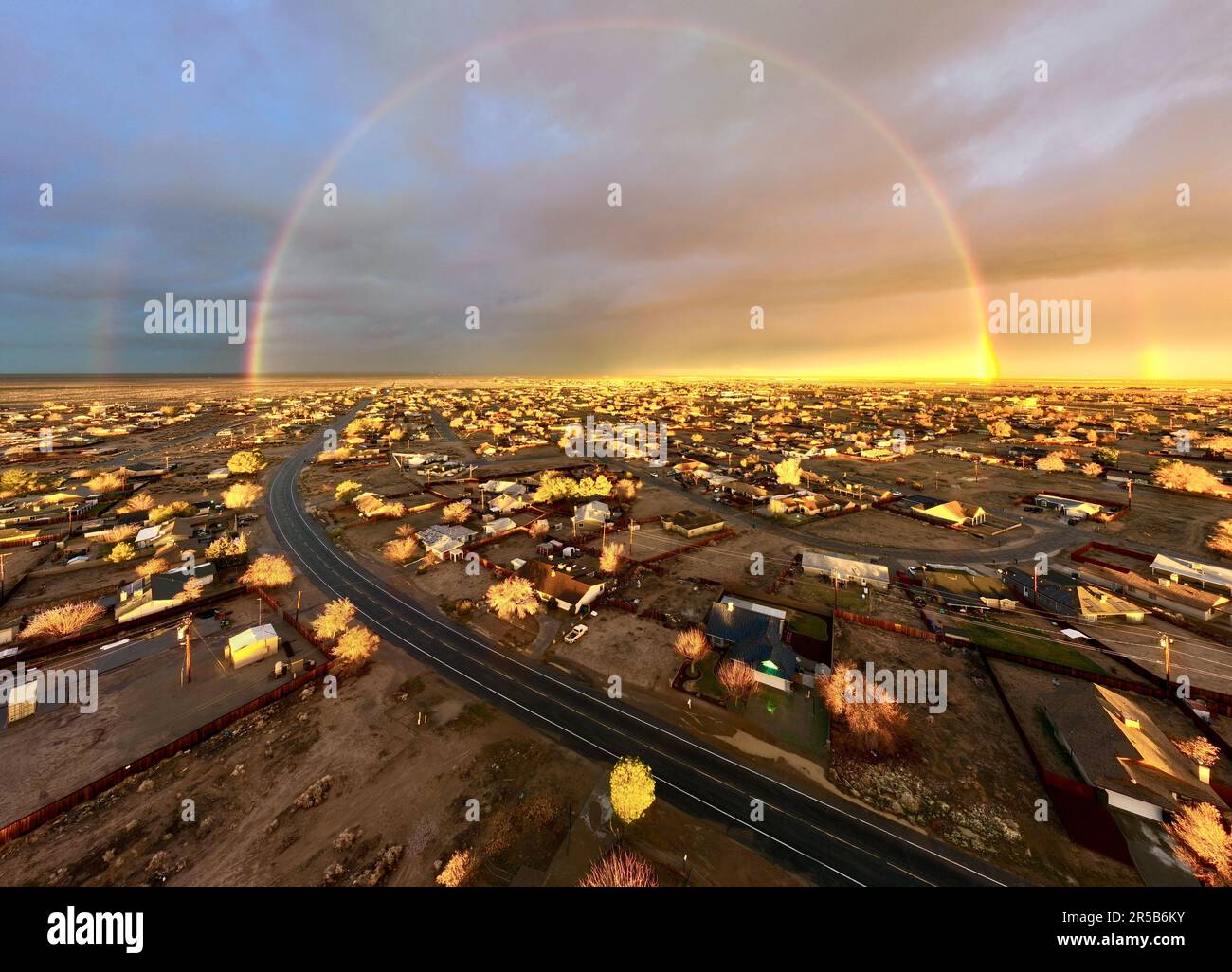 This vibrant image captures a stunning rainbow stretching across the ...