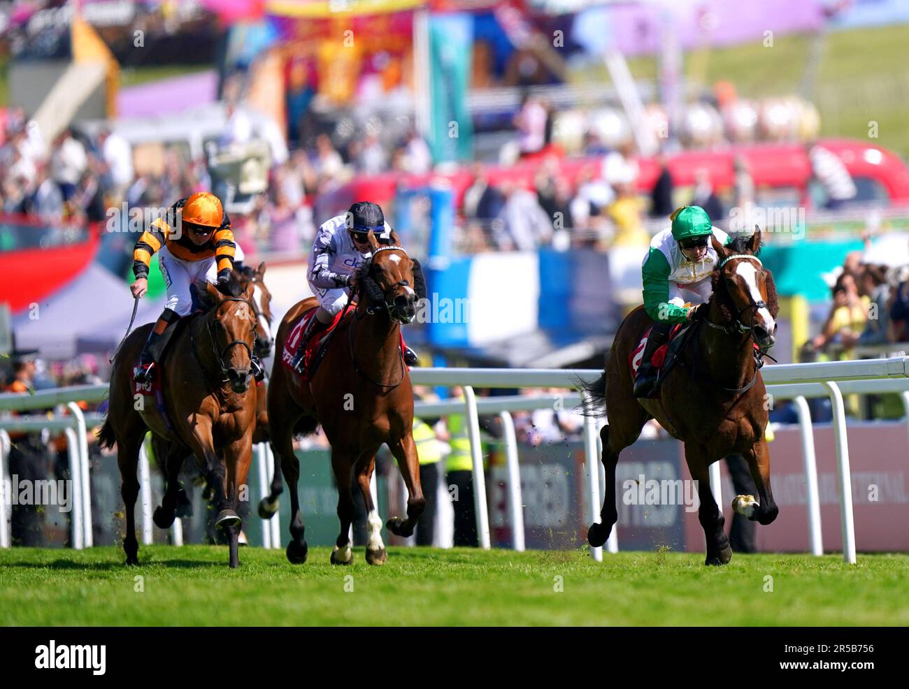 Cadillac ridden by jockey Kevin Stott (right) on their way to winning ...