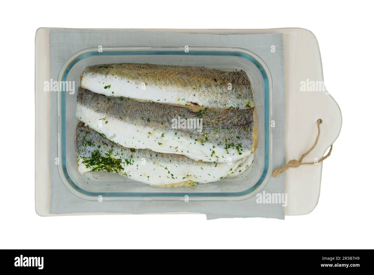 Marinated hake on a ceramic board isolated on white background. Ready ...