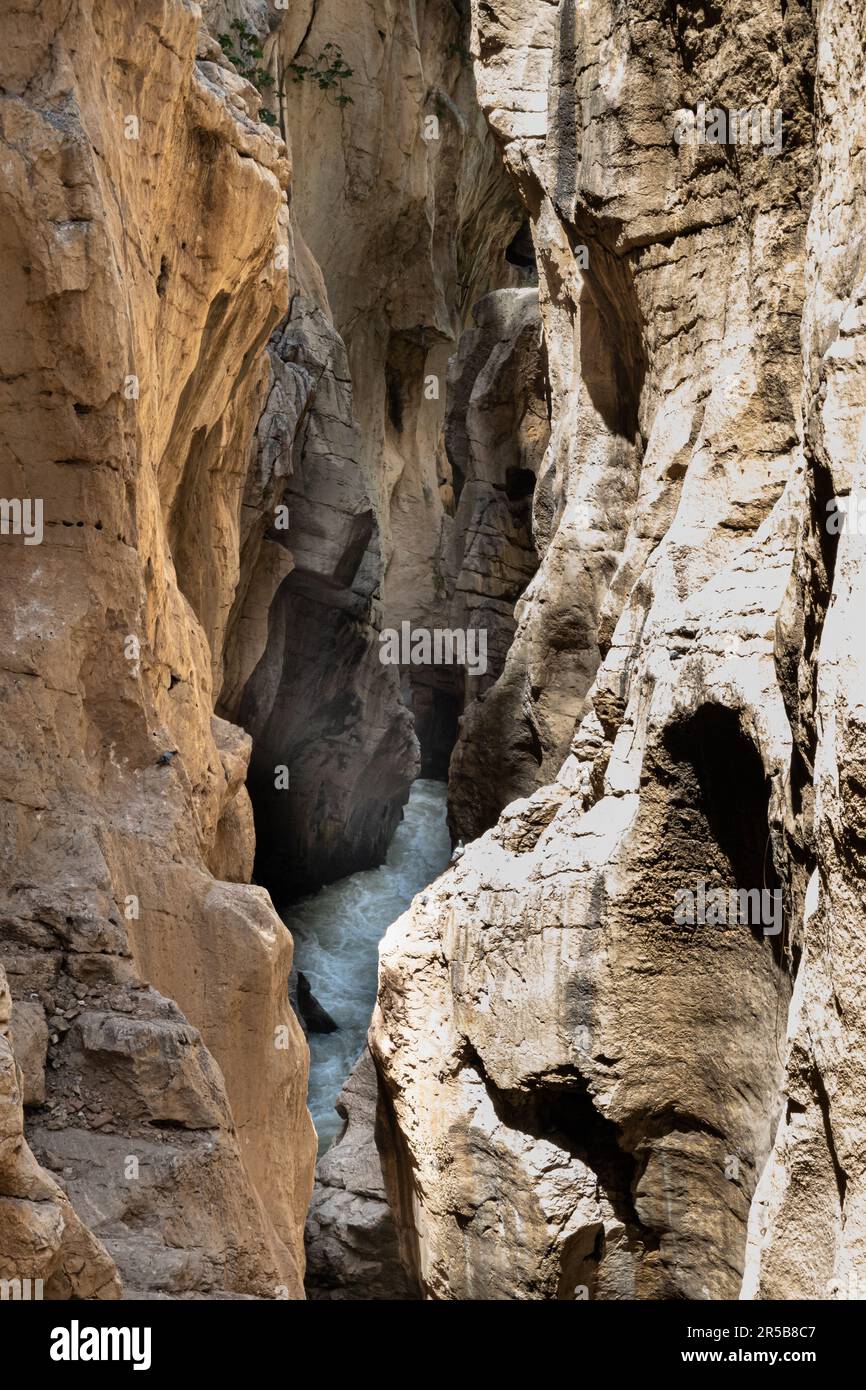 Perspective from above of canyon walls and river flow at the bottom of ...