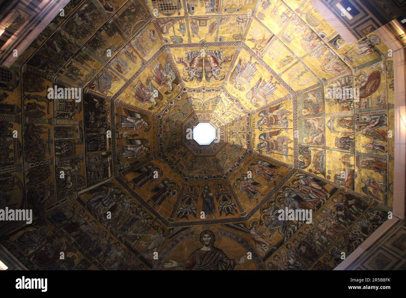 A low-angle shot of the ceiling painting of the Baptistery of Saint ...