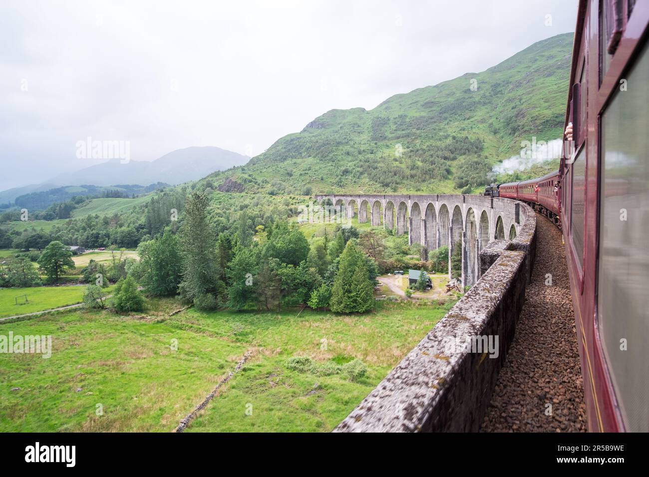 Jacobite Steam Train Locomotive passing Glenfinnan Viaduct Stock Photo ...
