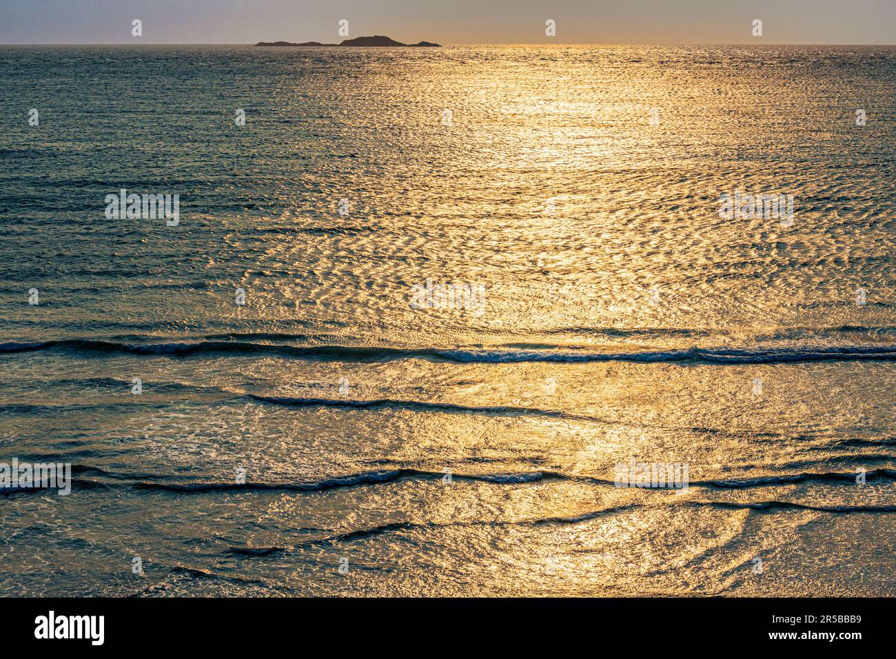 The sun setting over the sea at Whitesands Bay, a Blue Flag beach on ...