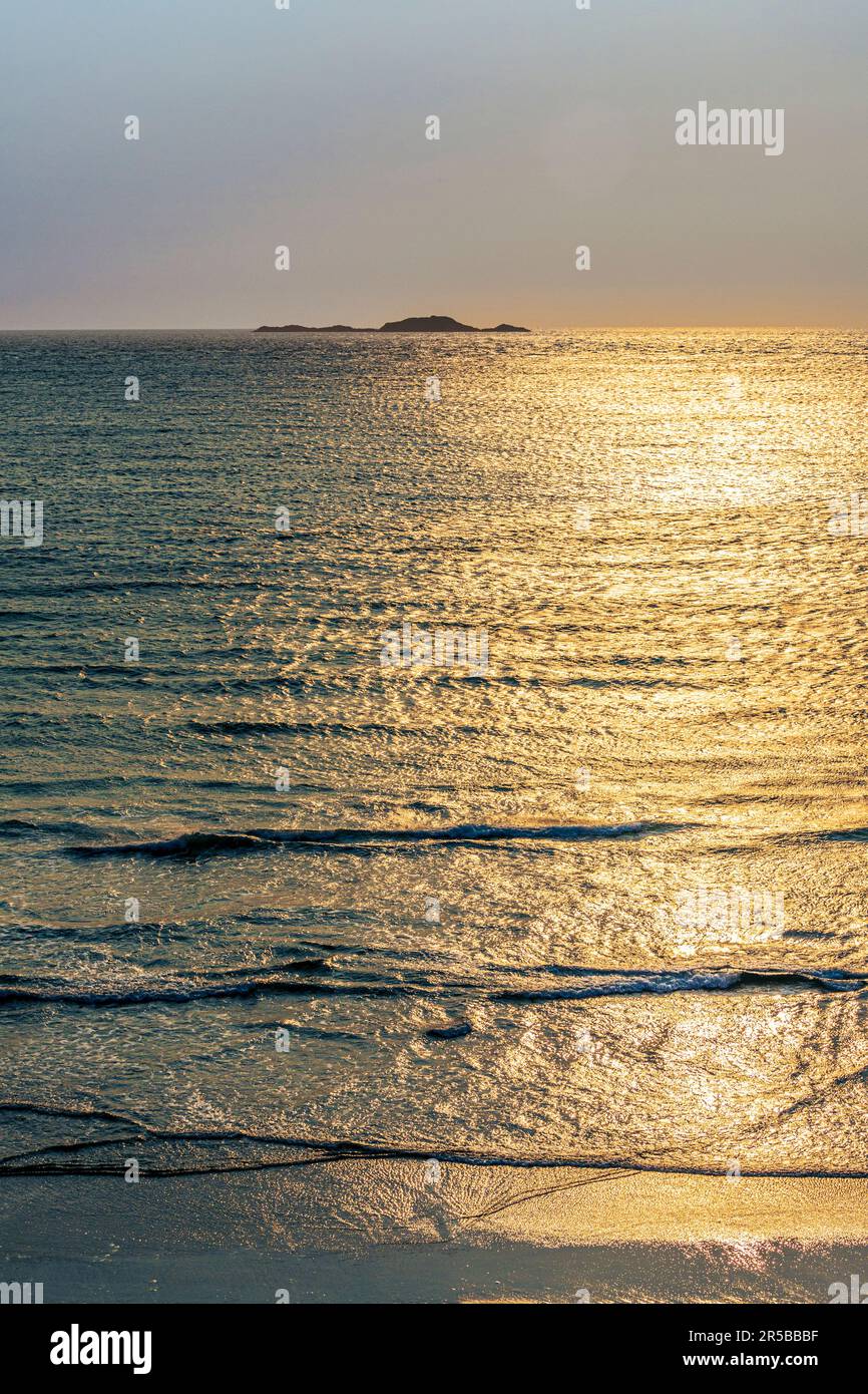The sun setting over the sea at Whitesands Bay, a Blue Flag beach on ...