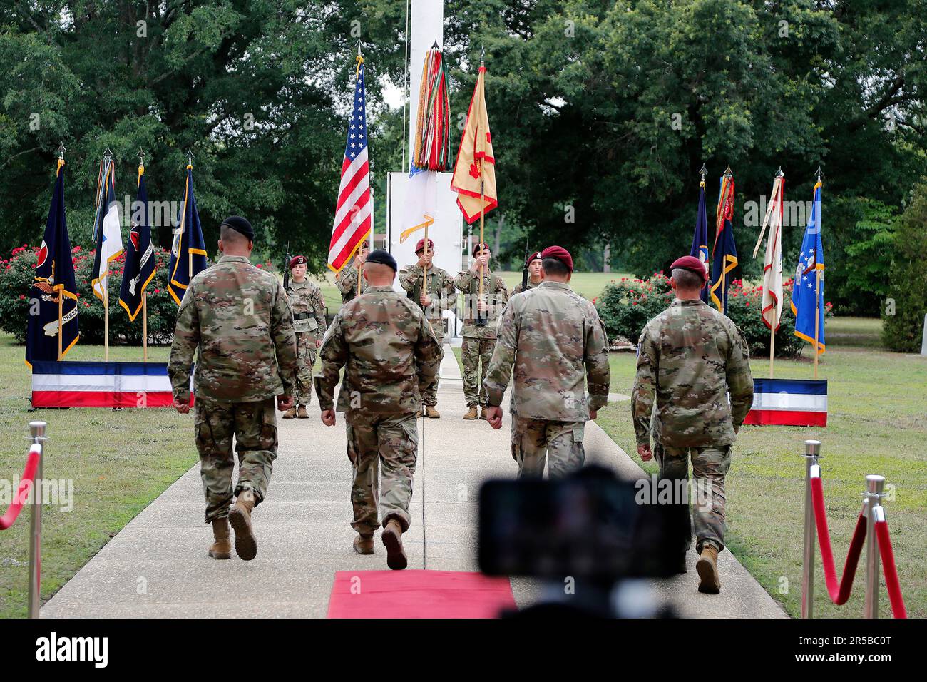 Commanding officers approach the color guard during a ceremony to ...