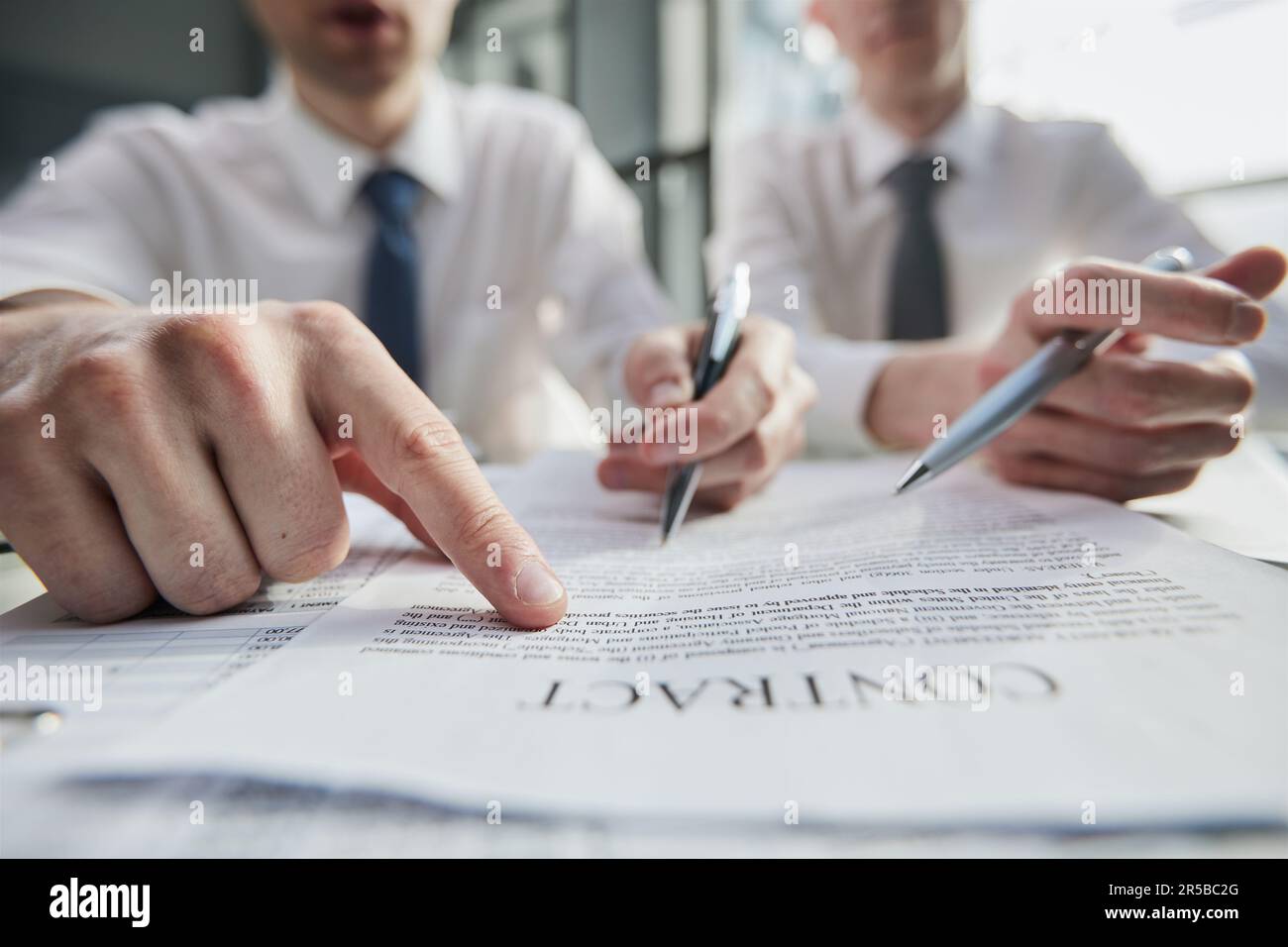 pointing a finger at one clause in a contract Stock Photo - Alamy