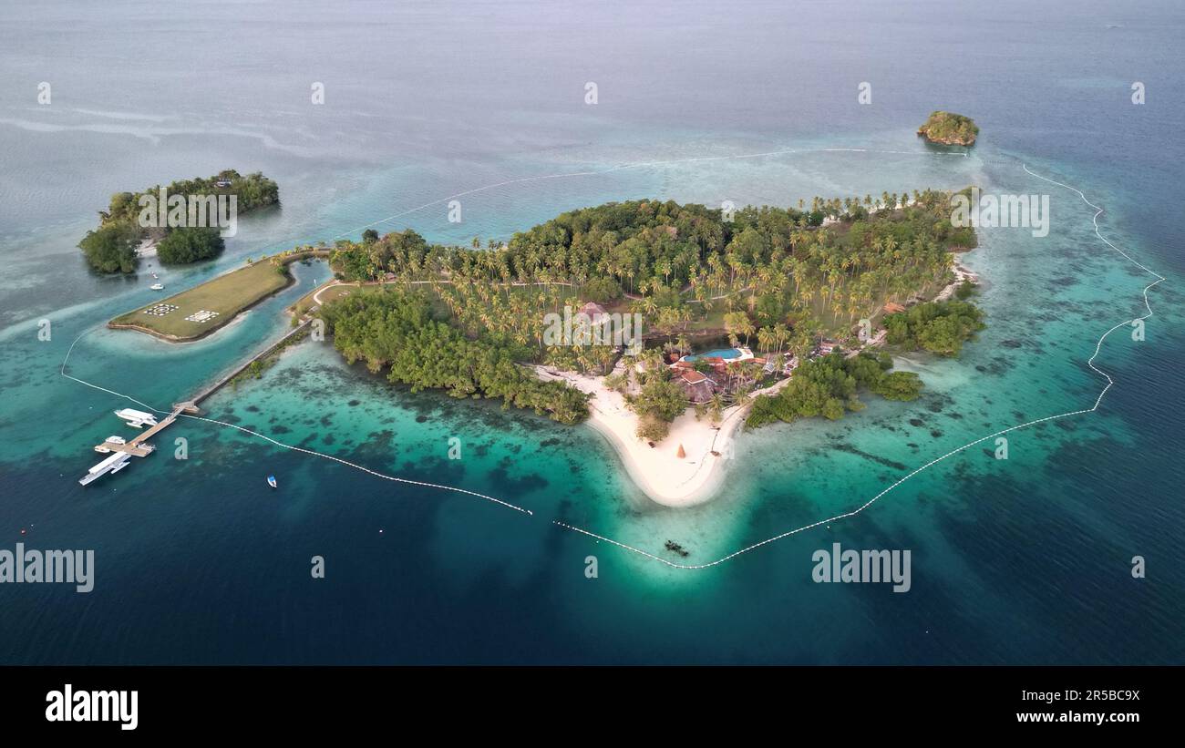 An aerial view of a tropical island populated with numerous colorful ...