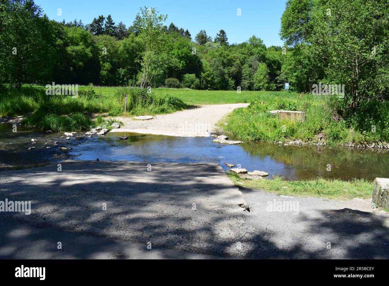 Road through a river Stock Photo - Alamy