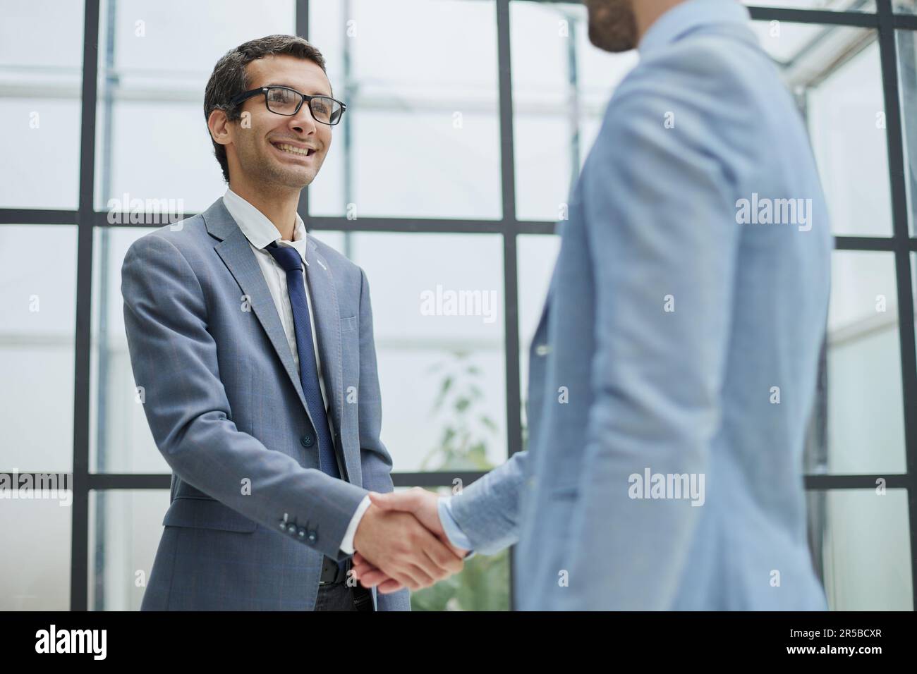 Two business men shaking hands together after successful meeting Stock ...
