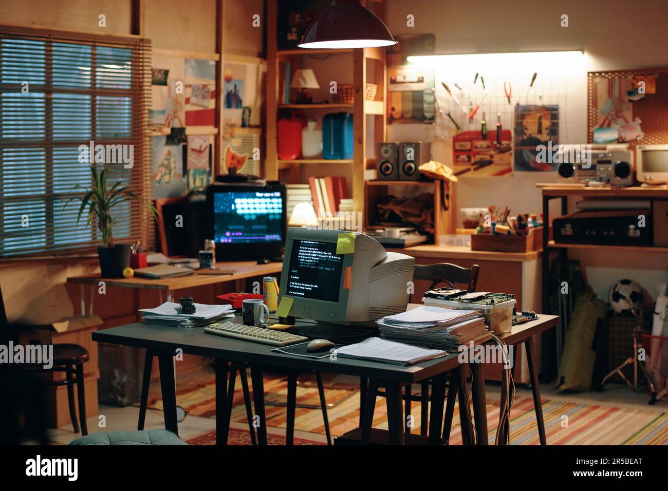 Garage with computers on table for developing new idea in IT technology ...