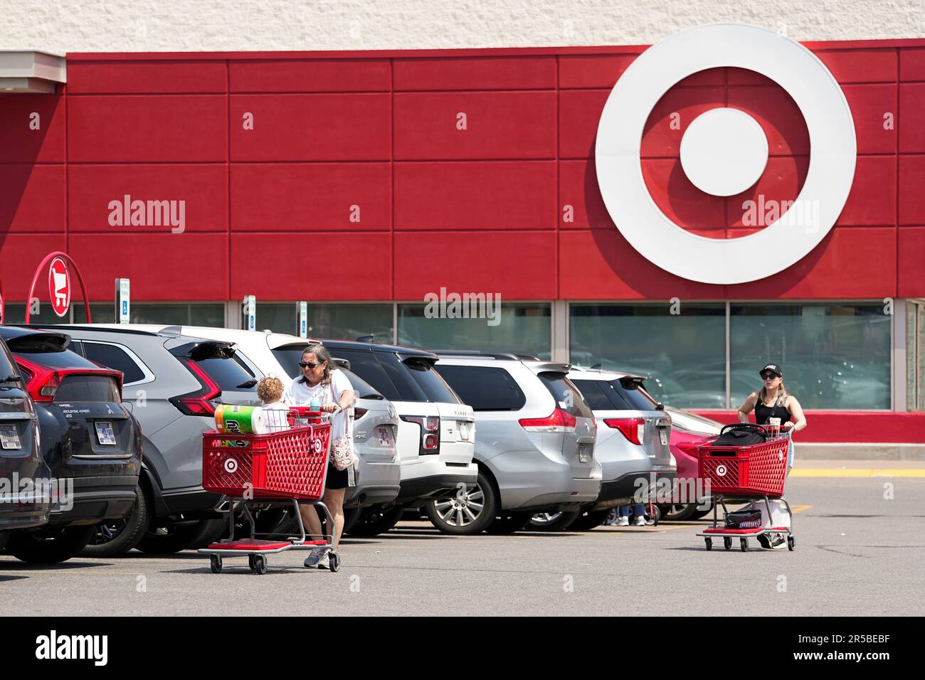 FILE - Customers make their way through the parking lot of a Target ...