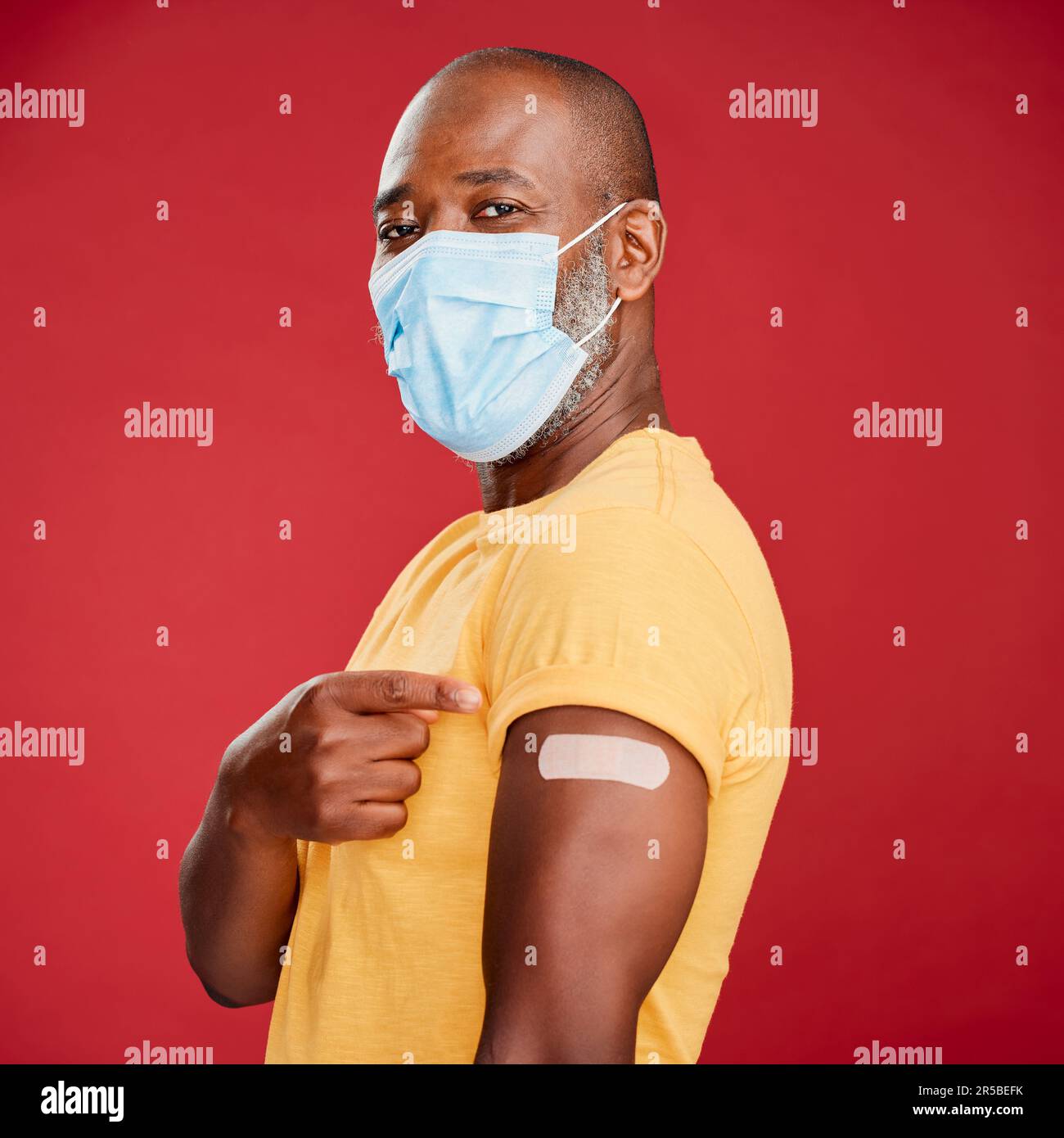 African man, covid and vaccine in studio portrait with pride ...