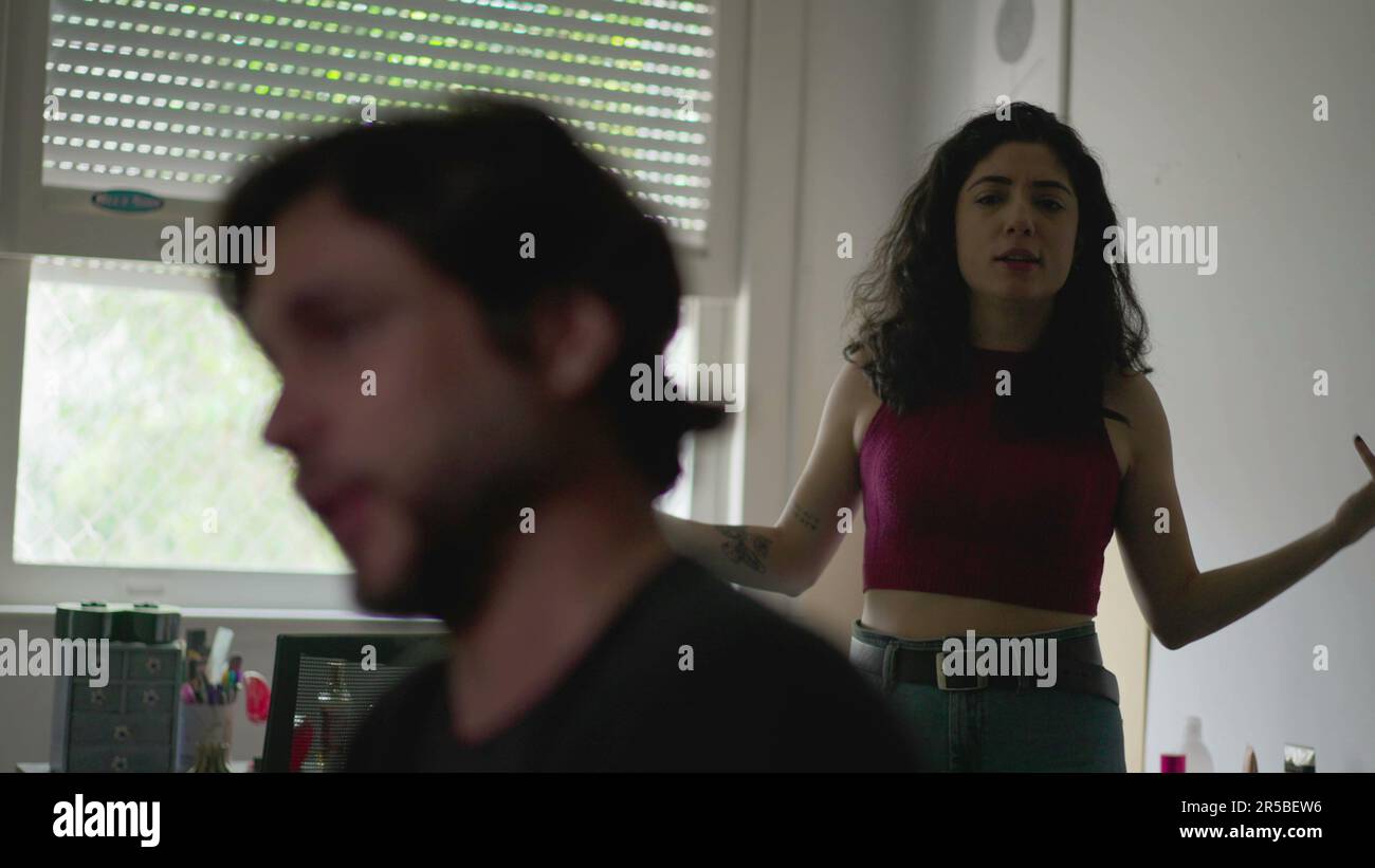 Couple arguing during heated debate. Female partner pointing finger at ...