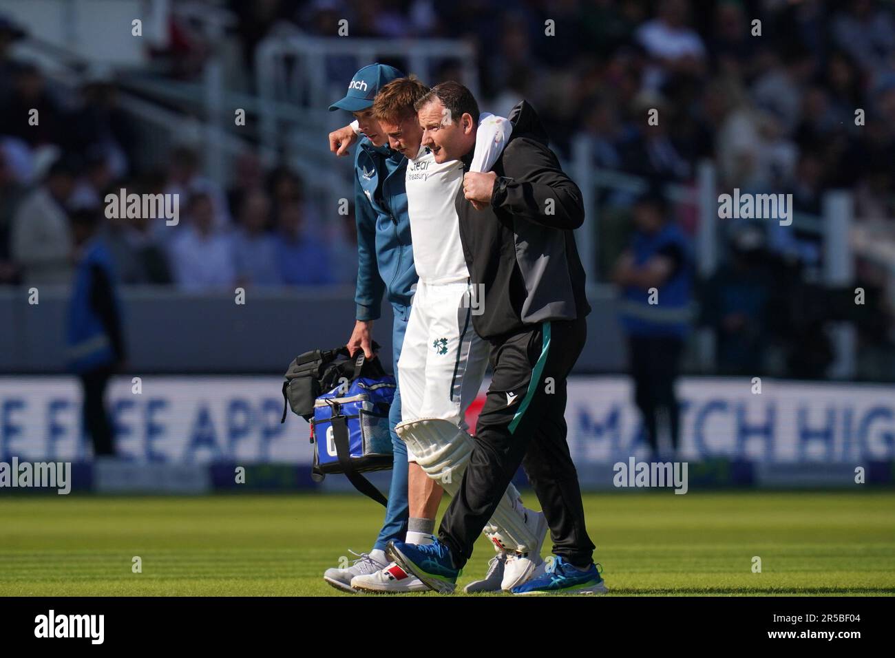 Ireland's James McCollum helped off the pitch after picking up a injury ...