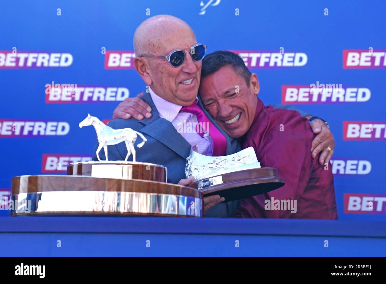 Jockey Frankie Dettori (right) celebrates with Betfred co-owner Peter ...