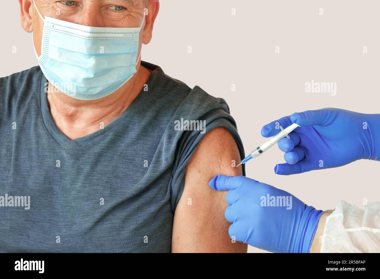 Doctor Vaccinating Senior Man In Clinic. Elderly People Vaccination ...