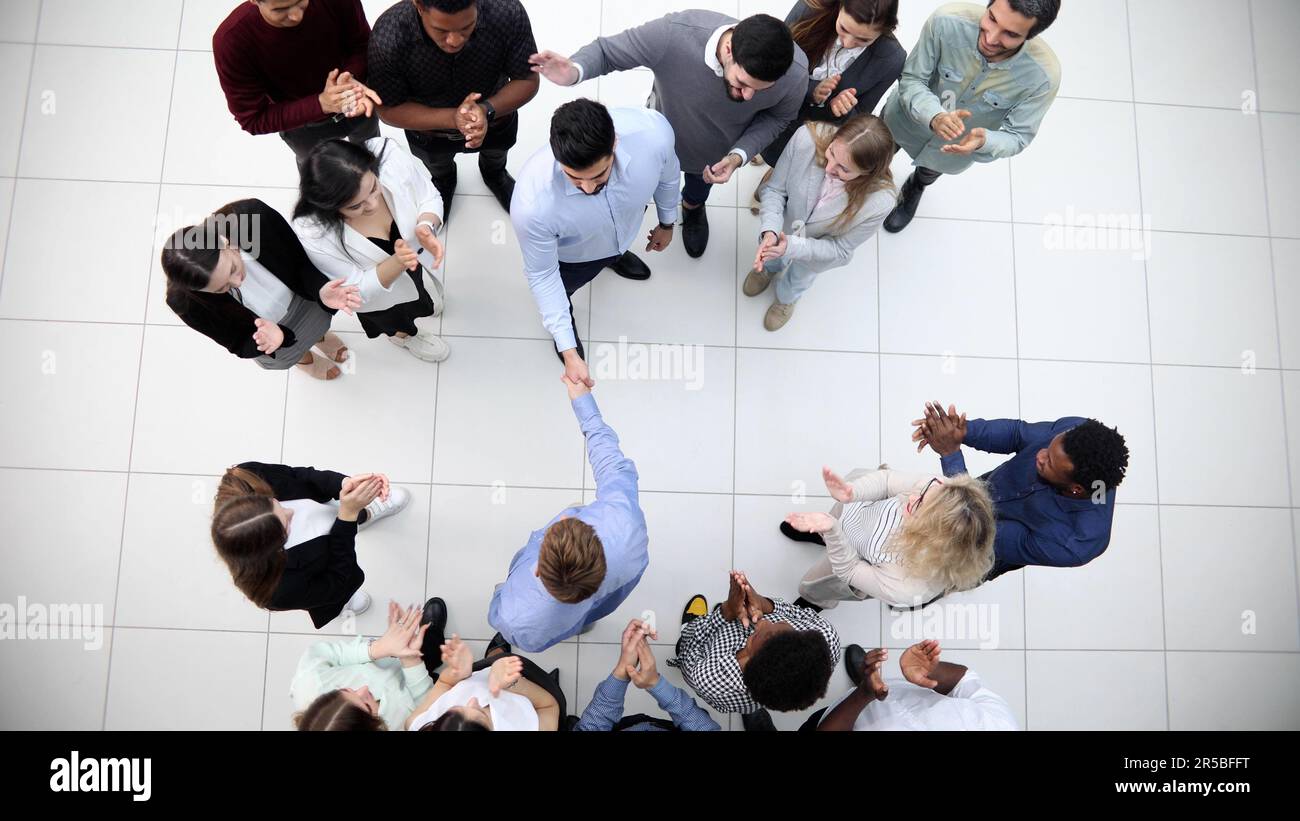 top view. a group of employees standing in the lobby of the office ...