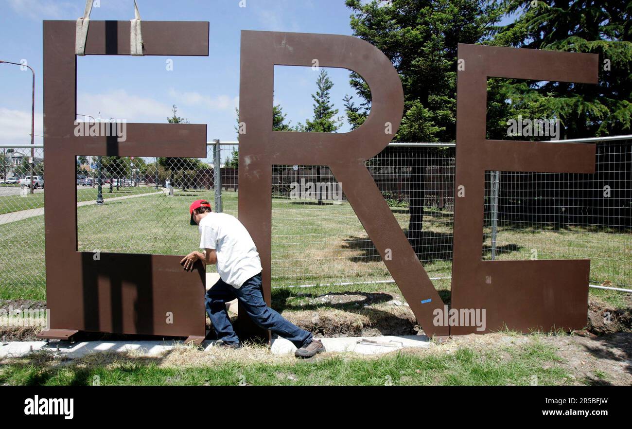 sculpture27 012 pc.jpg Eli Whitney, the artists' son, guides a letter ...