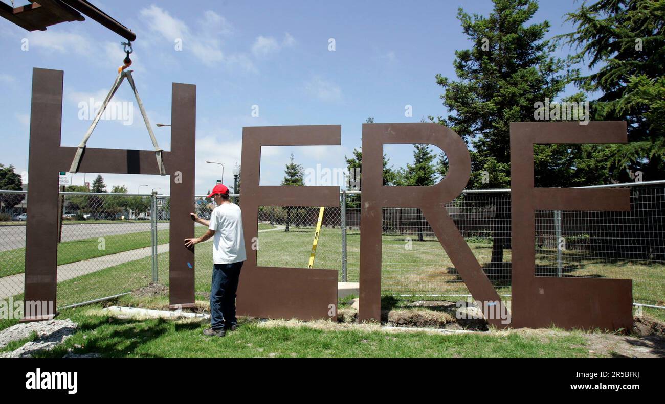 sculpture27 024 pc.jpg Eli Whitney, the artists' son, guides a letter ...