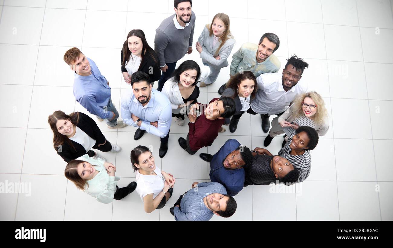 large group of diverse young people looking up hopefully Stock Photo ...