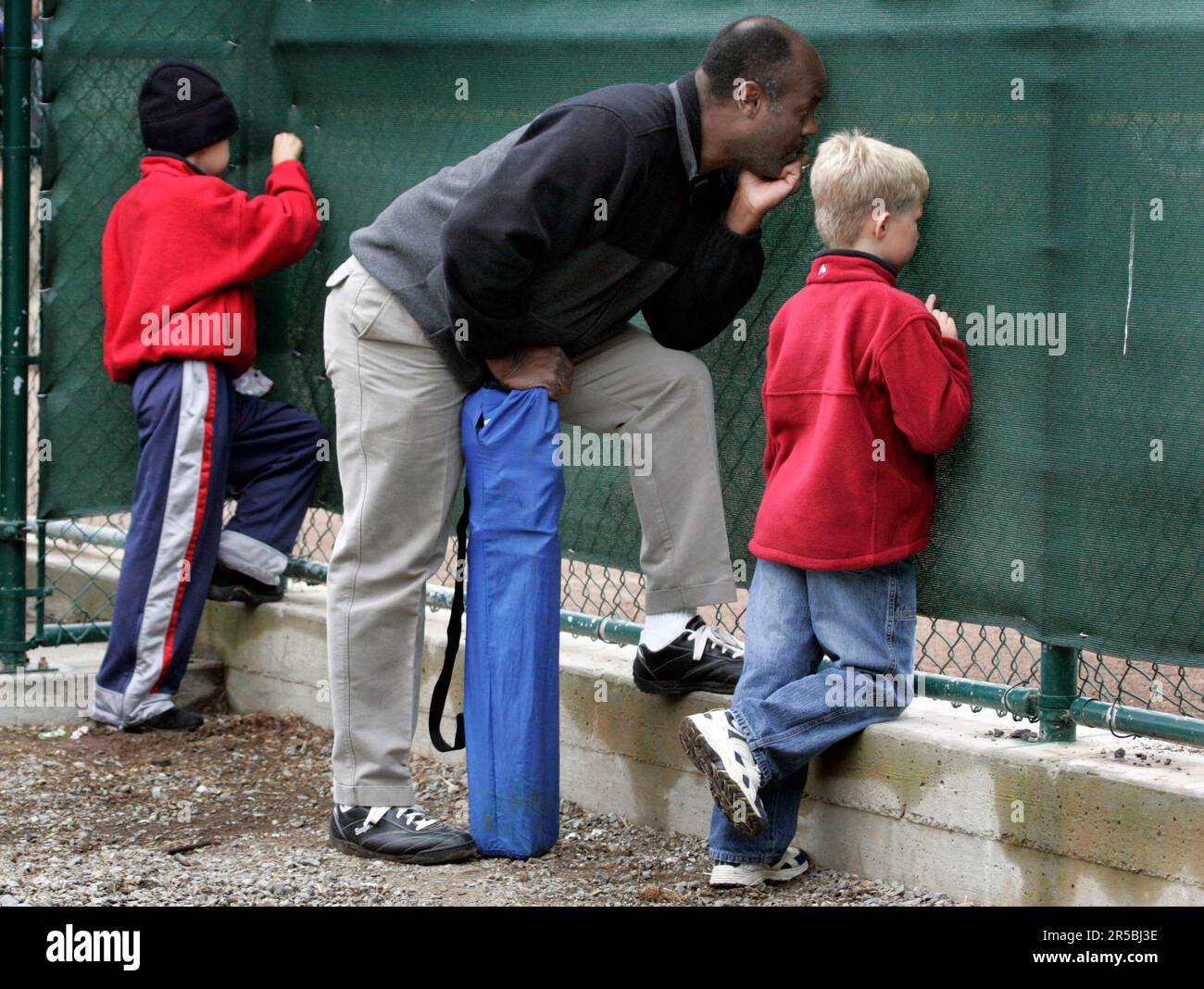pngianthelp15 062 pc.jpg Terry Whitfield watches the game through a ...