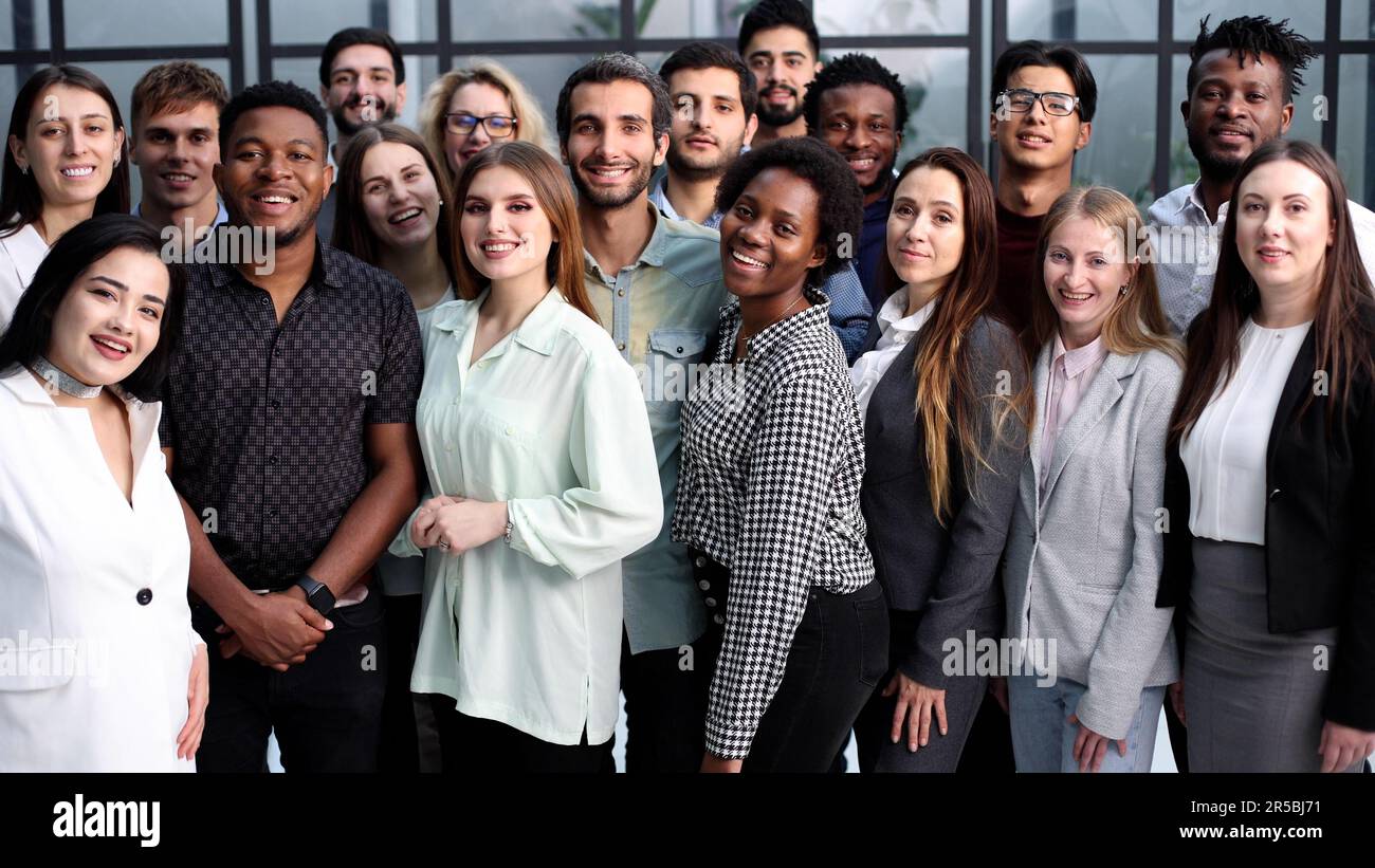 Large Group of people standing together in studio Stock Photo - Alamy