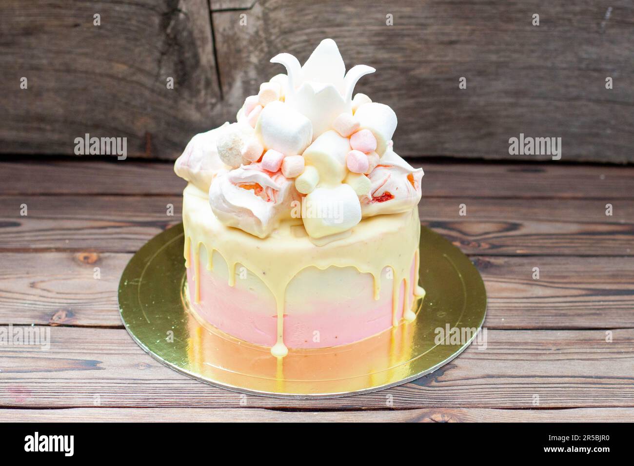Tender pink birthday cake with melted white chocolate, fondant crown ...