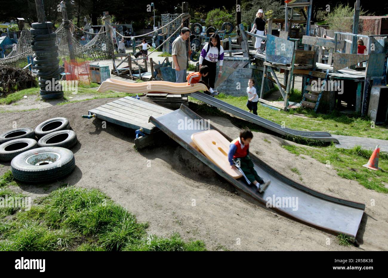 Children play on structures they build and dismantle using recycled ...