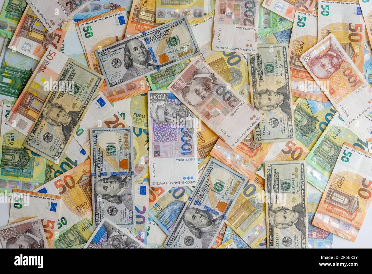 A close up of international currency notes arranged close to each other ...