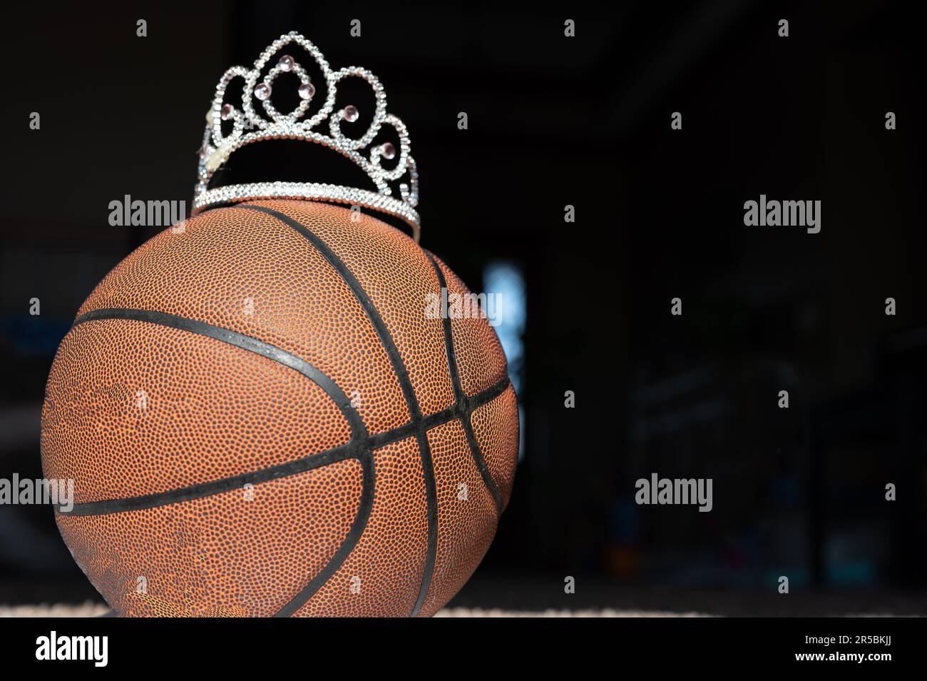 Basketball, tiara, and blank bracket signifying a Cinderella season ...