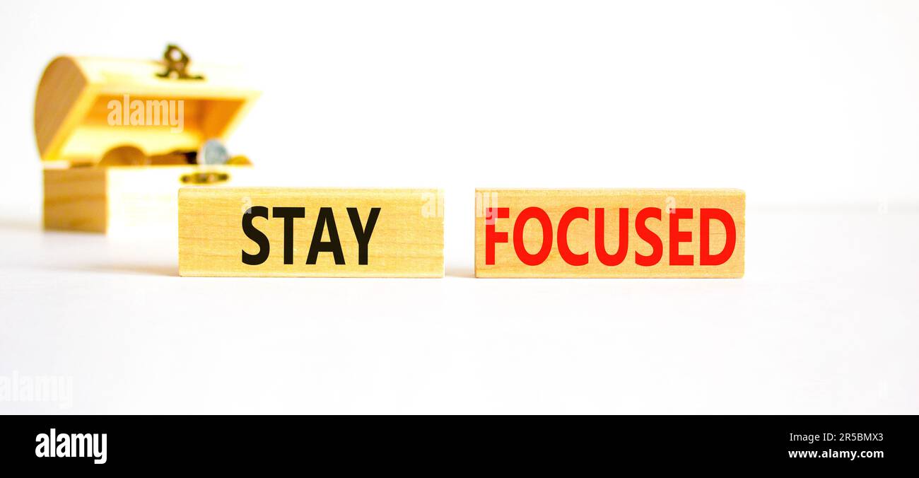 Stay focused symbol. Concept words Stay focused on wooden blocks on a ...
