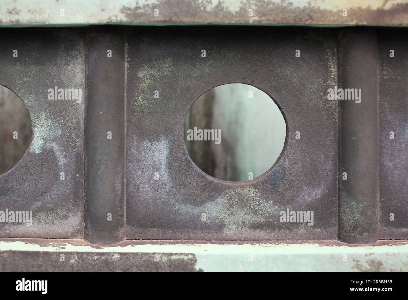 A circular hole carved into a copper metal wall Stock Photo - Alamy