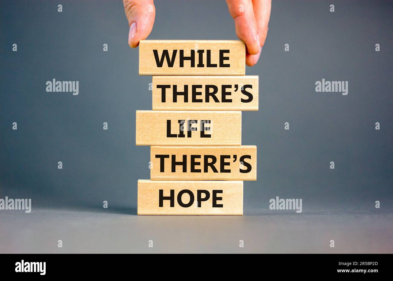 Life and hope symbol. Concept word While there is life there is hope on ...