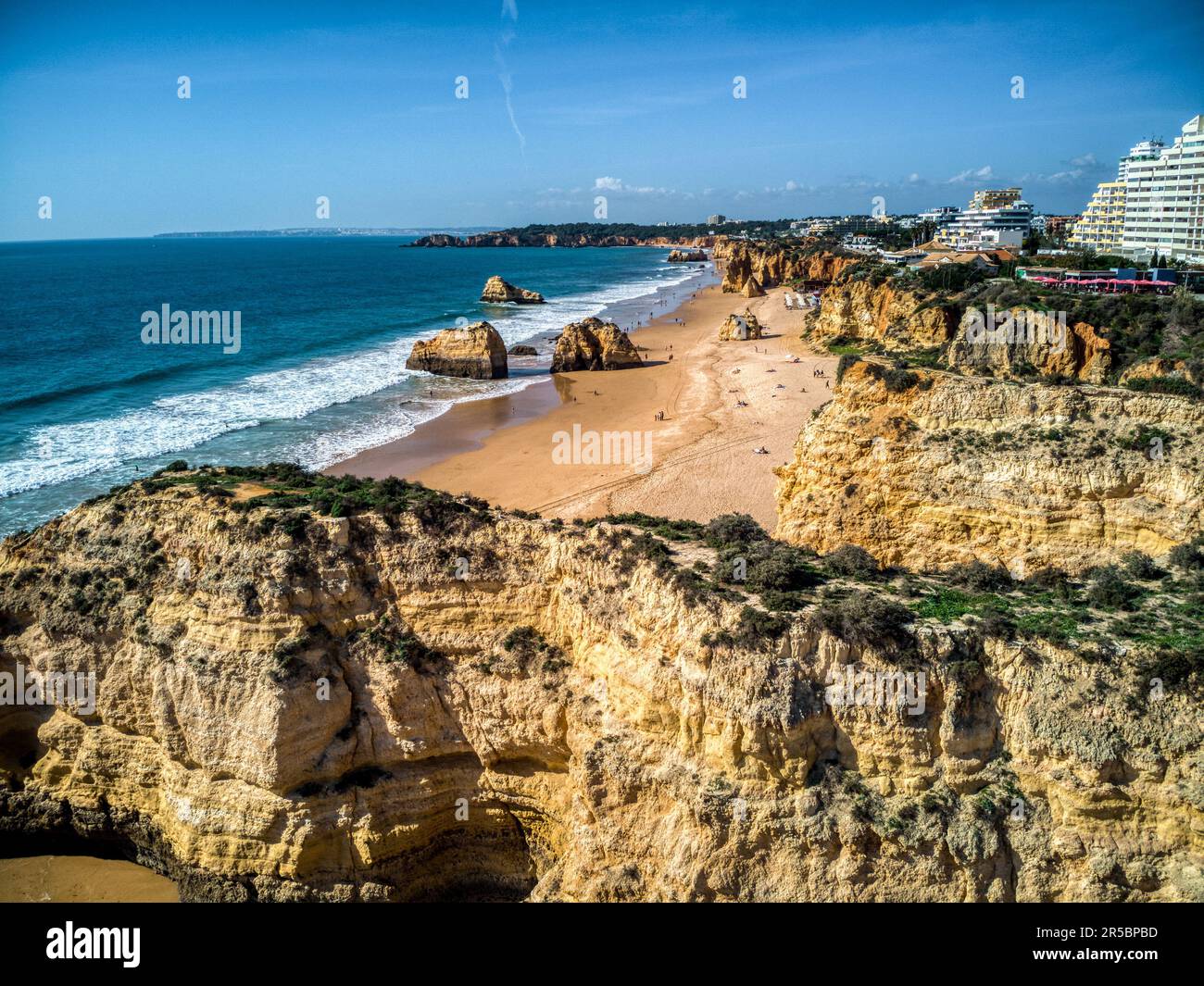 A stunning beach of Algarve, Portugal with majestic rocky cliffs ...