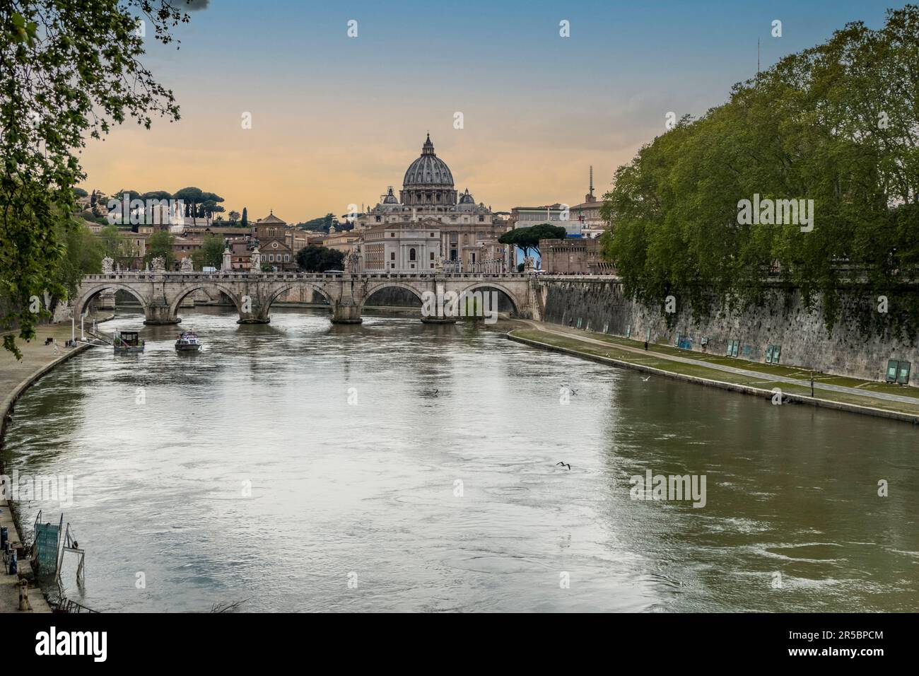 The Tevere river with the Vatican in background at sunset Stock Photo ...